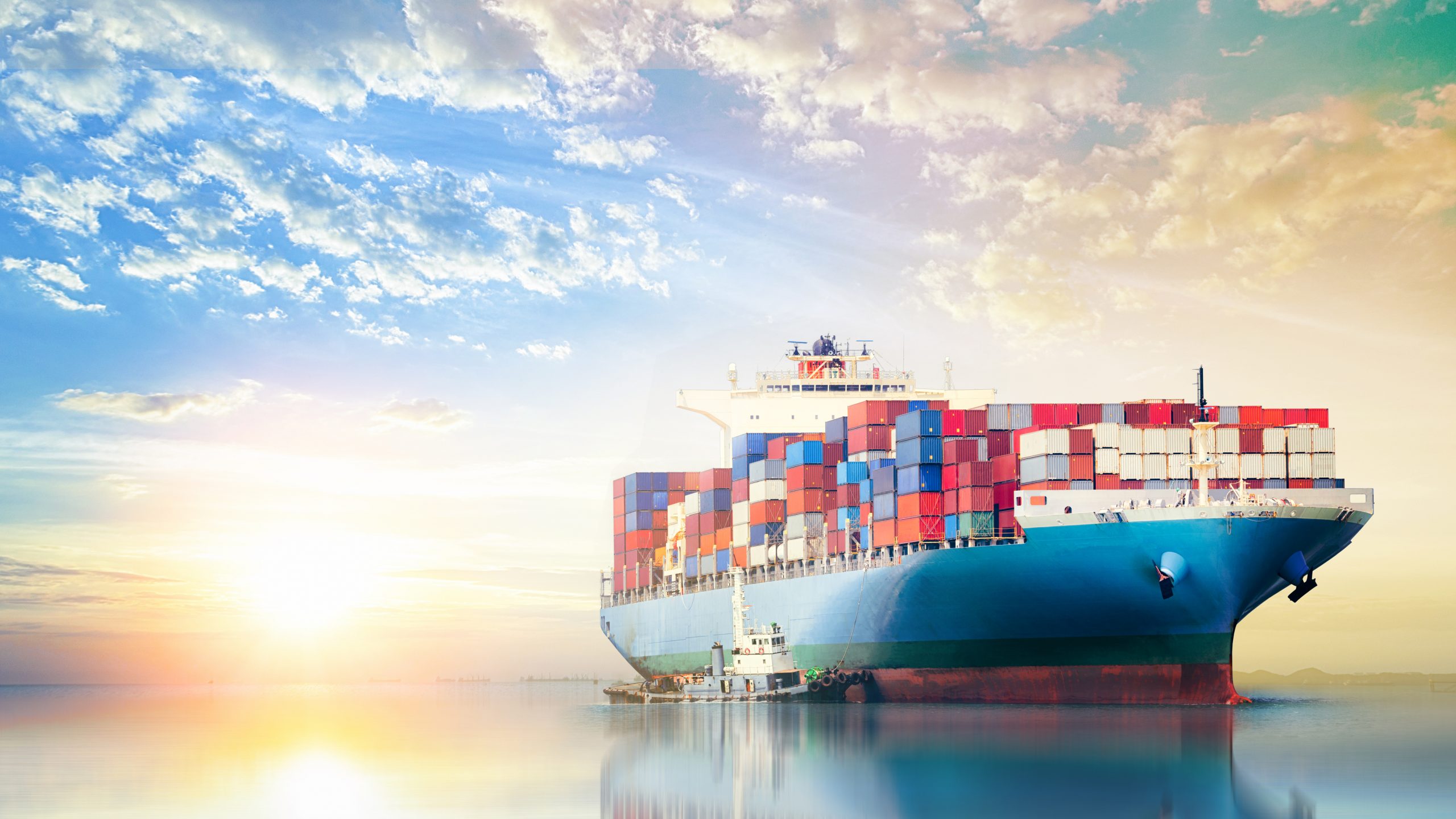 International Container Cargo Ship In The Ocean At Sunset Sky Freight