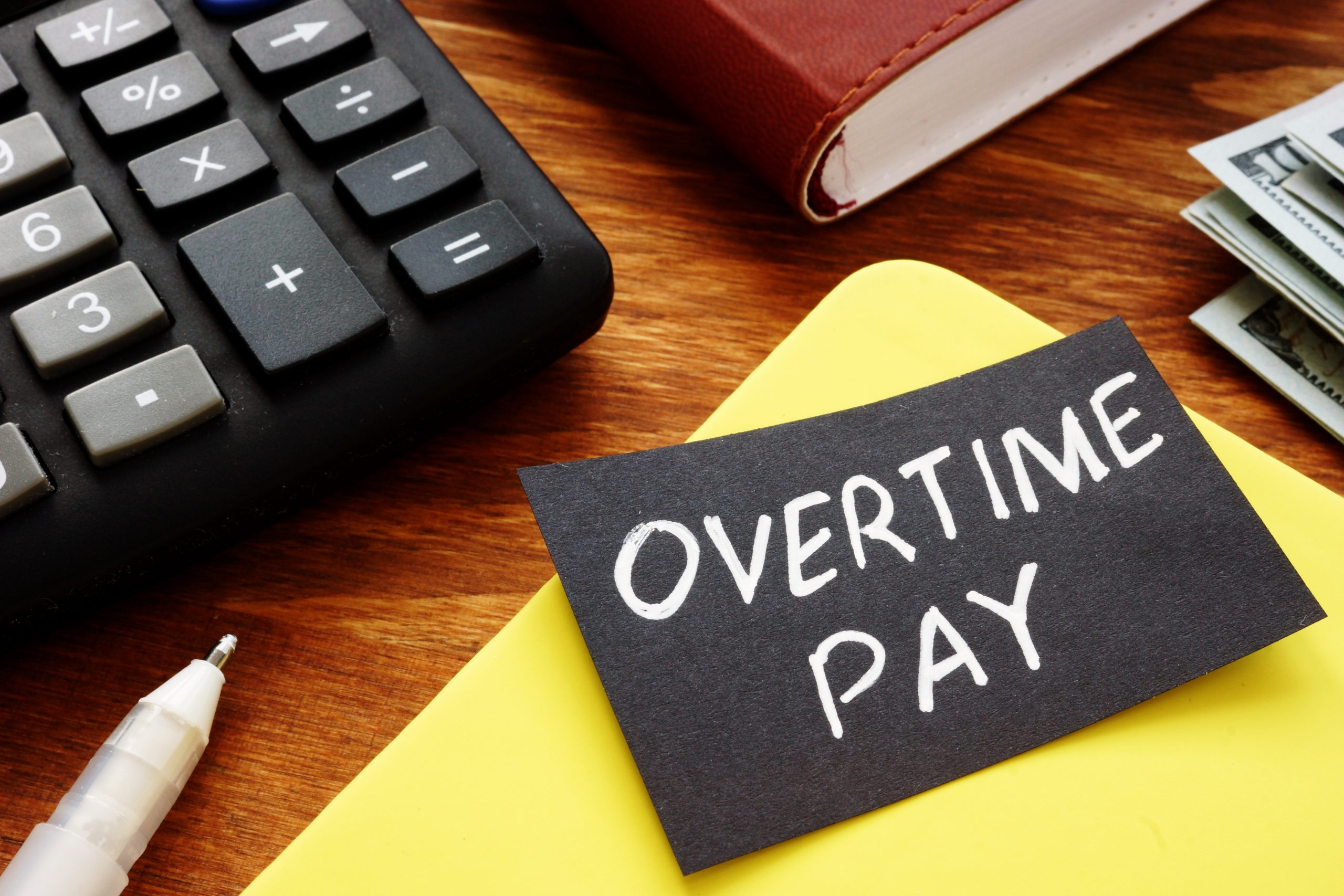 Text sign showing hand written words Overtime pay - CMBG3 Law